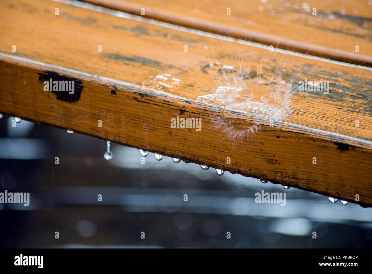 Drop of water on wood with raindrop Stock Photo - Alamy