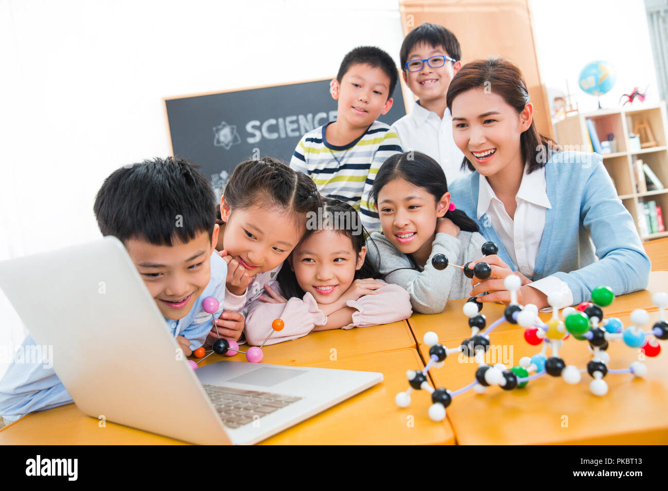 Female teachers and students use computers in the classroom Stock Photo ...