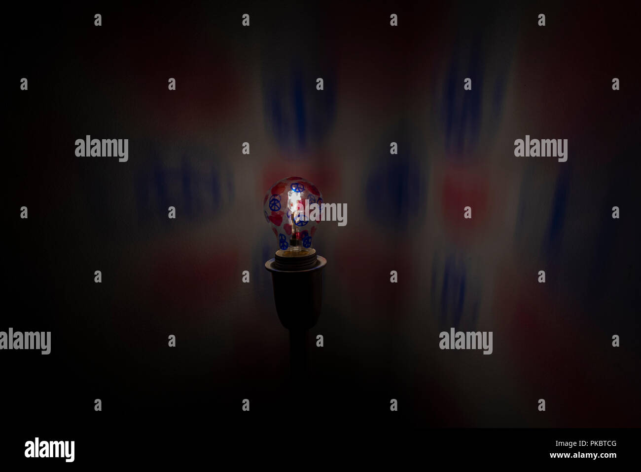 Light bulb with peace and love signs painted on it Stock Photo - Alamy