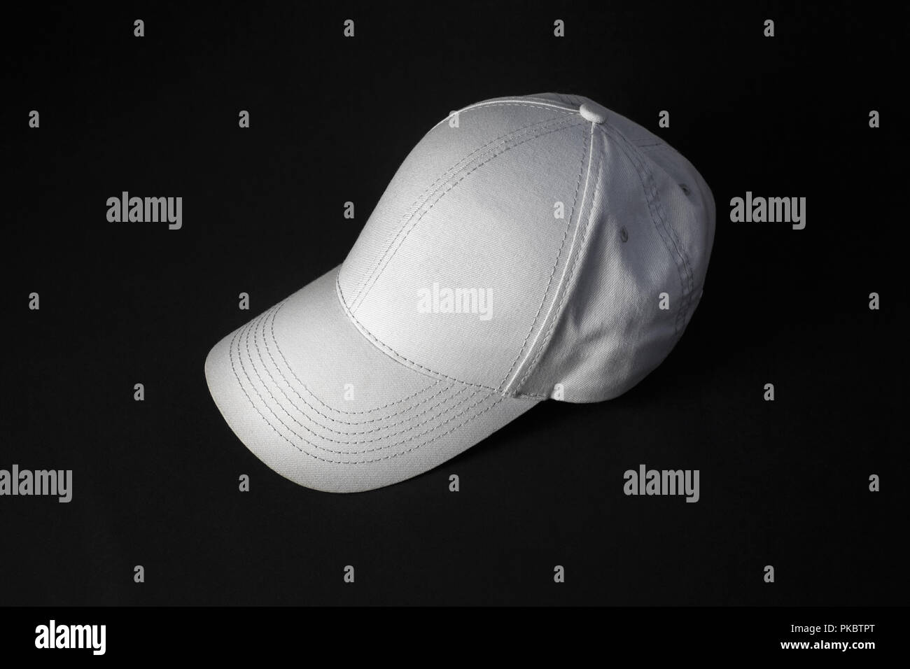 Blank baseball cap on black background. Responsive design mockup Stock ...