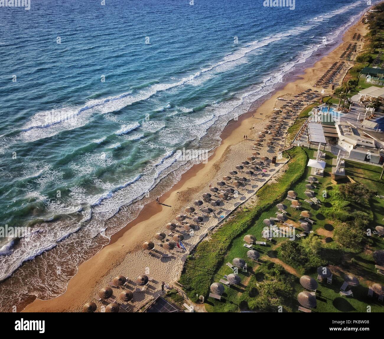 long stretch of sand beach along Greek coast Stock Photo - Alamy