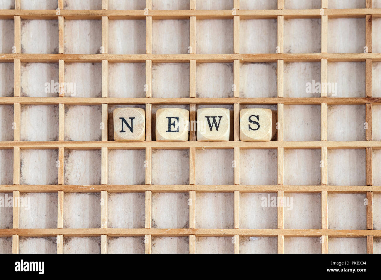 News sign created with wooden dices on a shelf Stock Photo - Alamy
