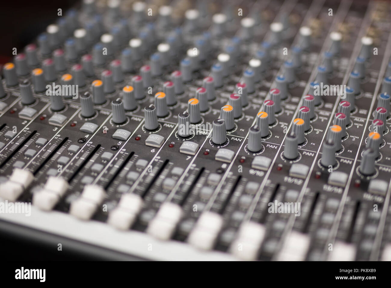 Close up view at mixing console in studio Stock Photo - Alamy
