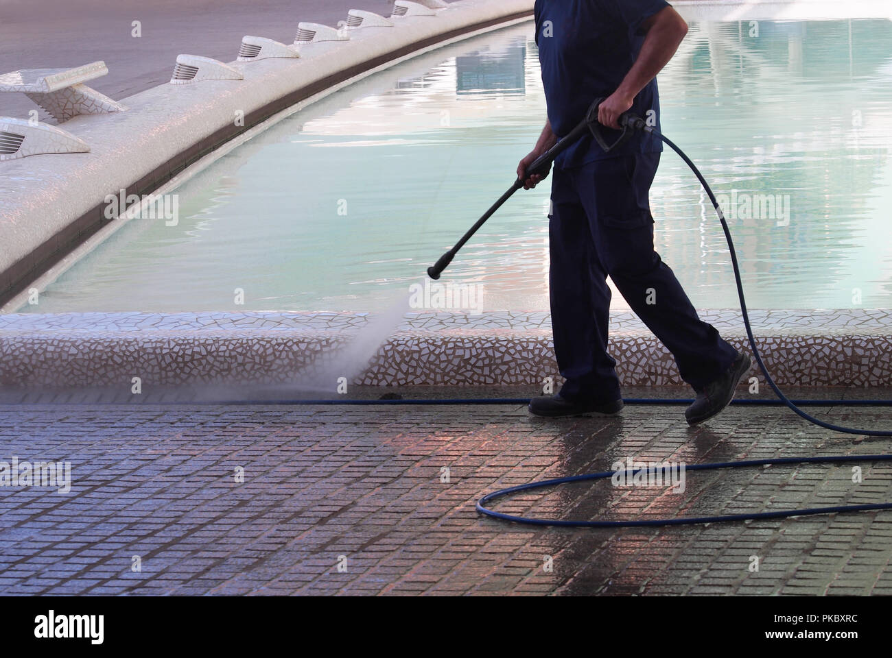 City workers - cleaning and washing of city streets Stock Photo - Alamy