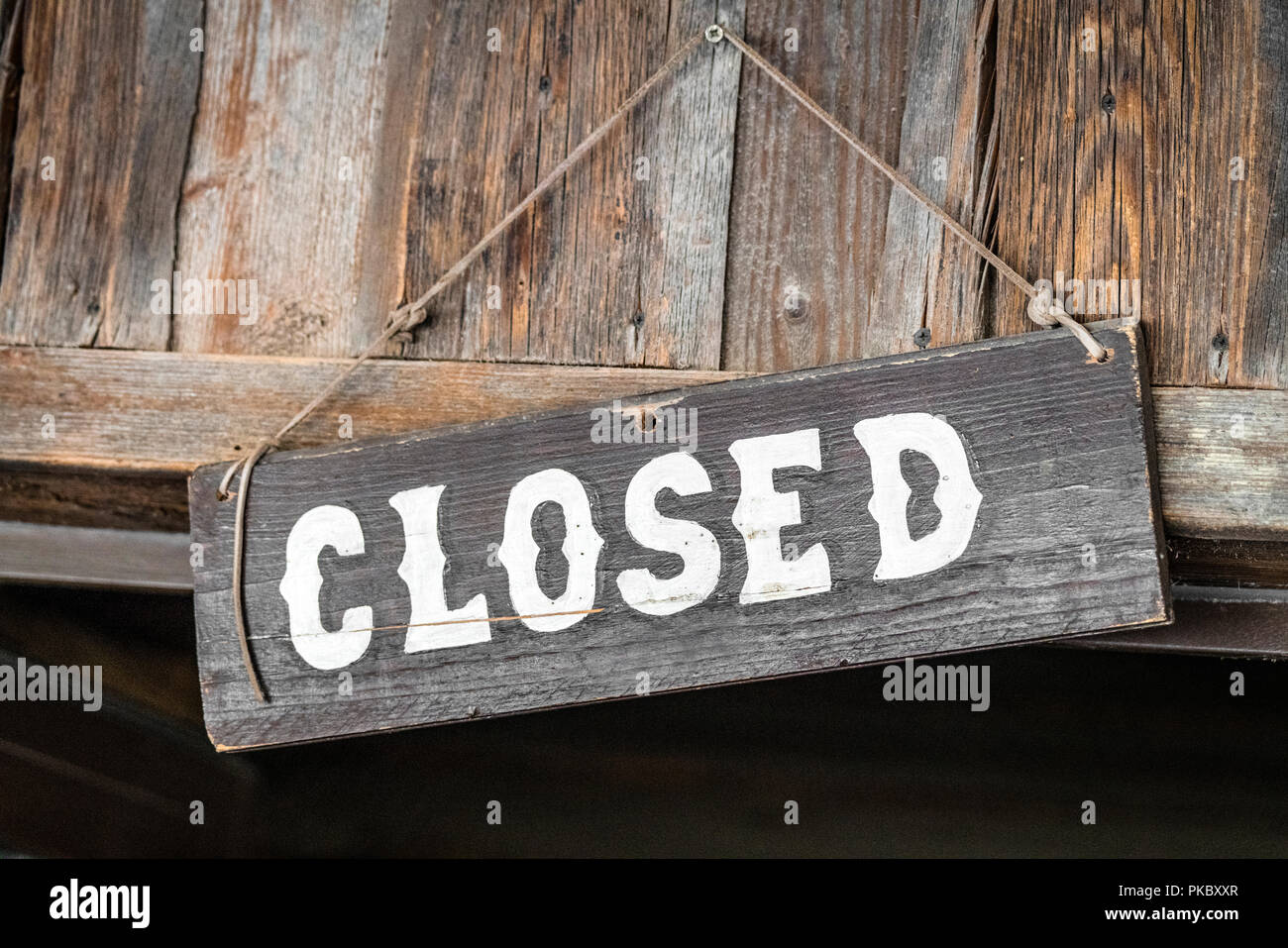 Closed for business sign made of wood in western style Stock Photo - Alamy