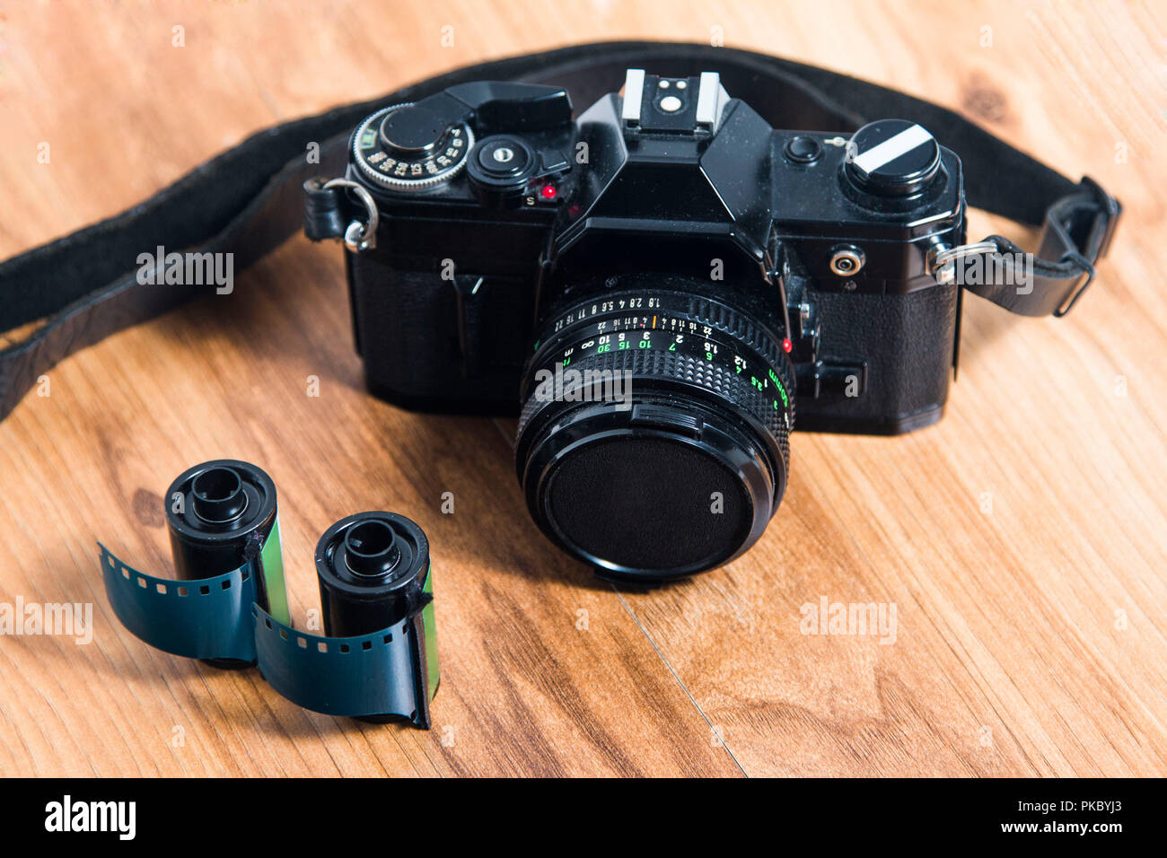 Old 35mm analog camera on the table Stock Photo - Alamy