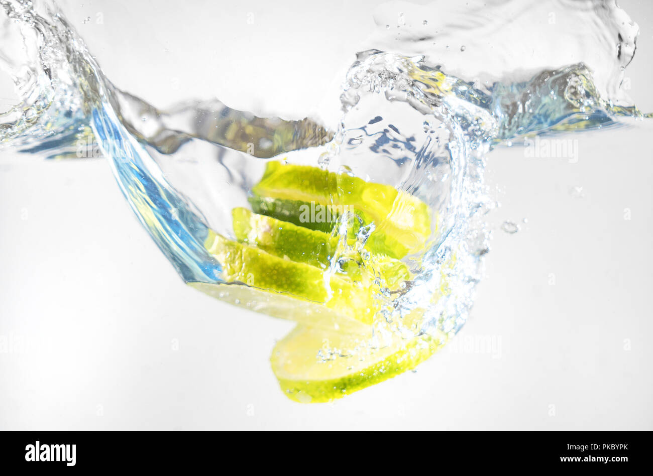 Sliced lime lemon falling water hi-res stock photography and images - Alamy