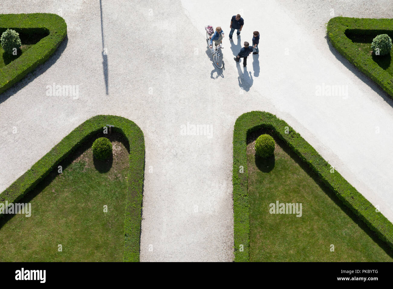 Aerial view of people at a cross path in a garden Stock Photo - Alamy