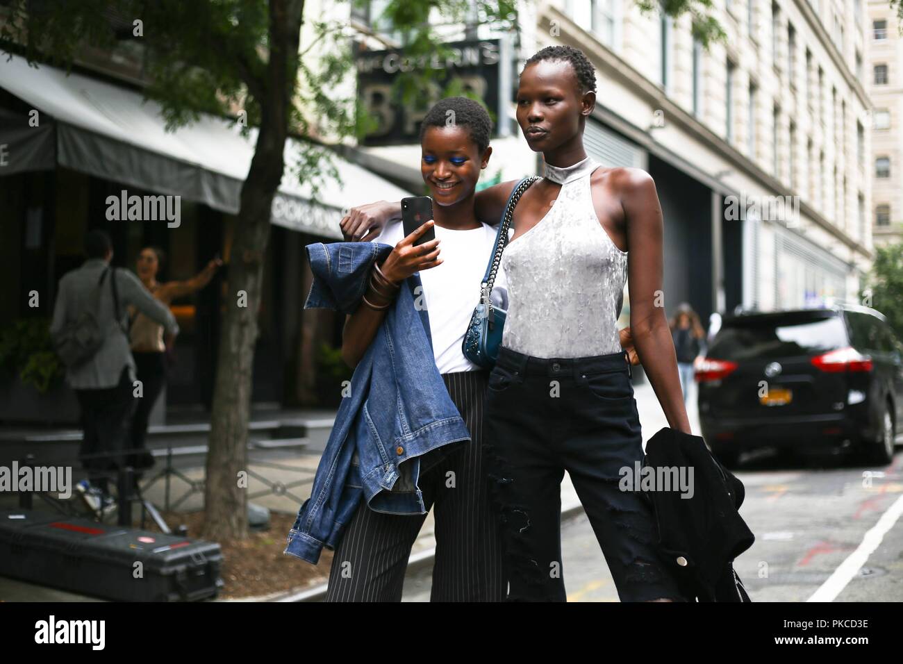 Models posing on the street during New York Fashion Week - Sept 11 ...