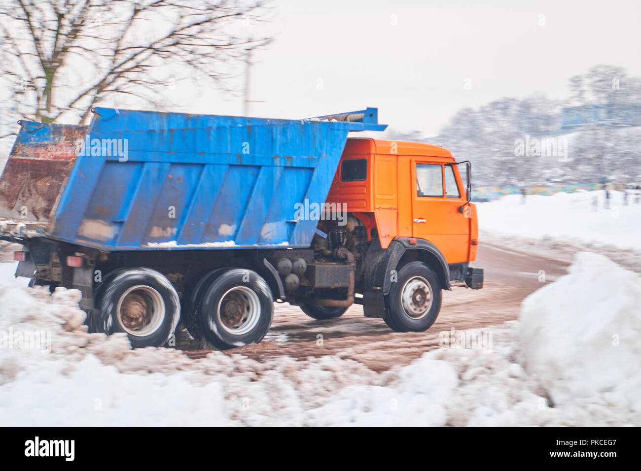 Cargo truck transporting snow pile. Wintern cleaning equipment Stock ...