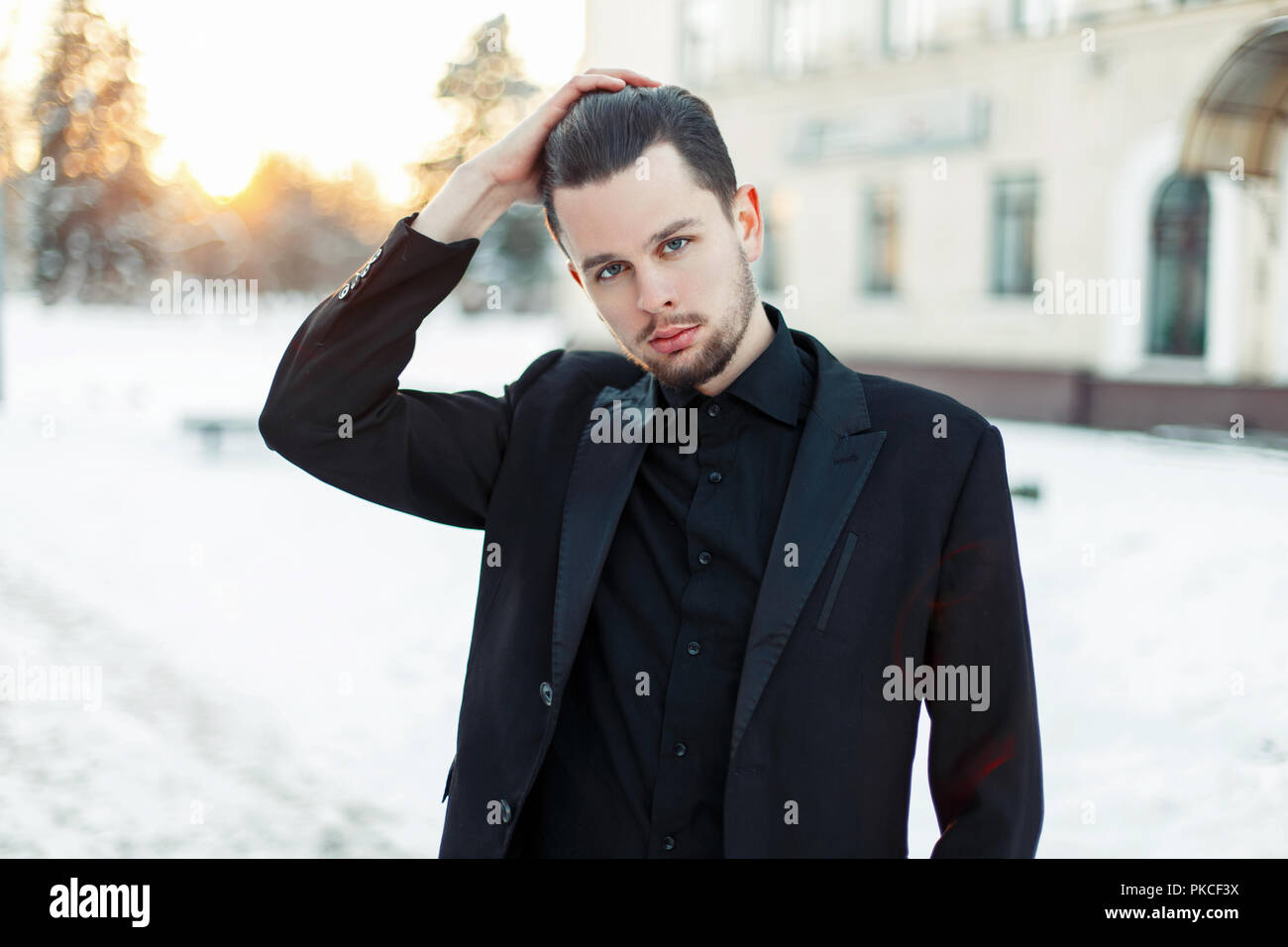 Male model posing in snow hi-res stock photography and images - Alamy