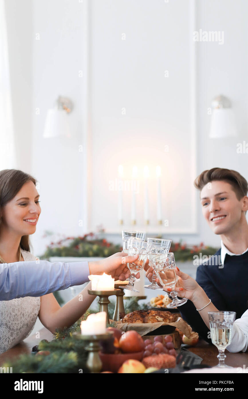 Christmas Day. Celebration dinner with group of friends Stock Photo - Alamy