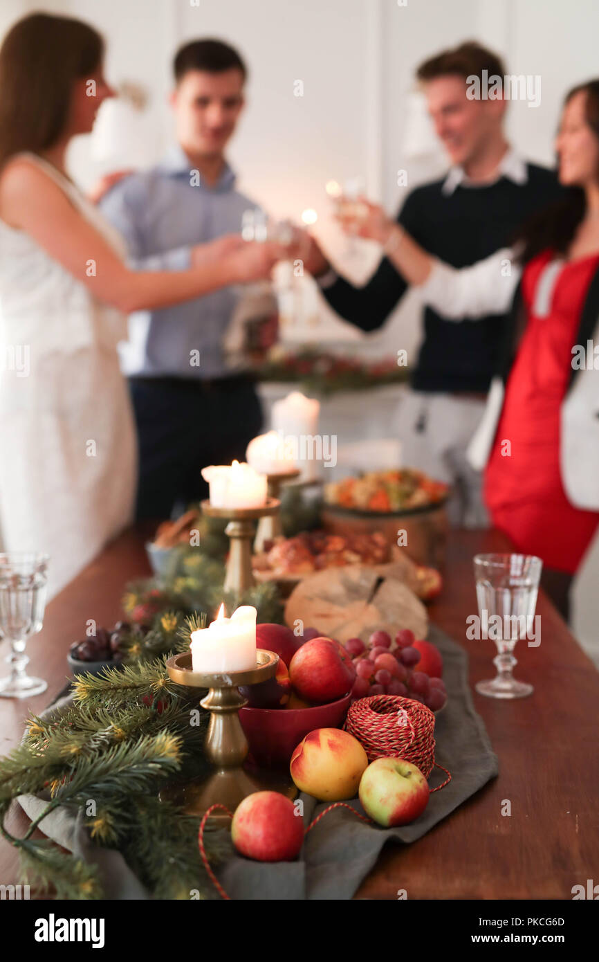 Christmas Day. Celebration dinner with group of friends Stock Photo - Alamy