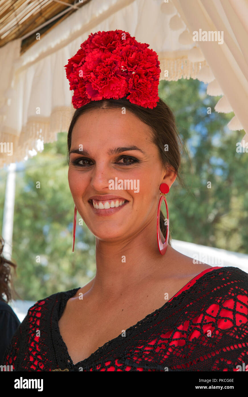 Woman wearing a colourful gypsy dress, Pentecost pilgrimage of El Rocio ...
