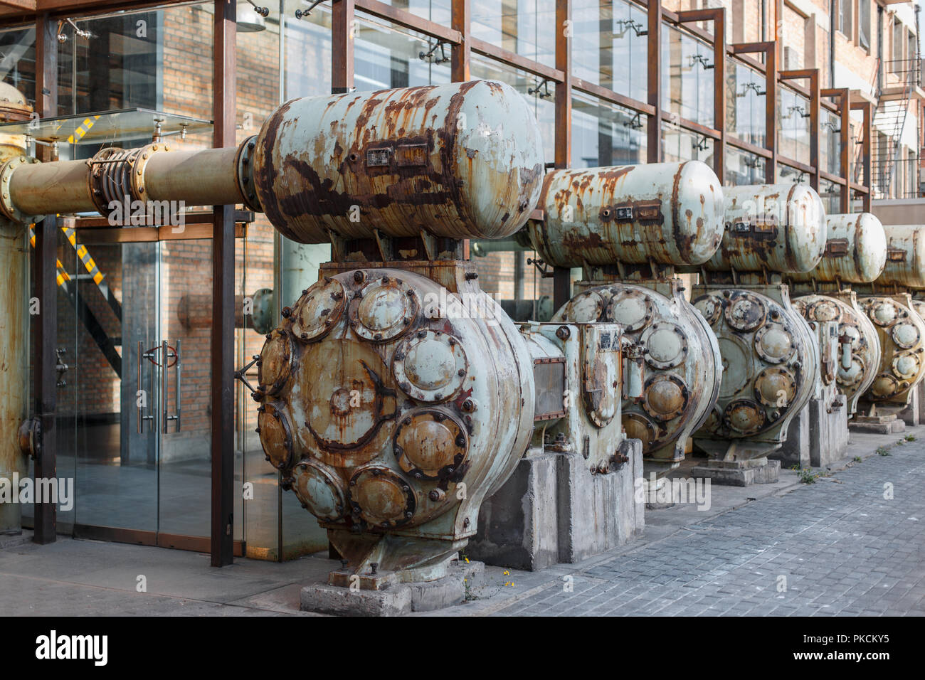 Vintage factory with metal machines Stock Photo - Alamy