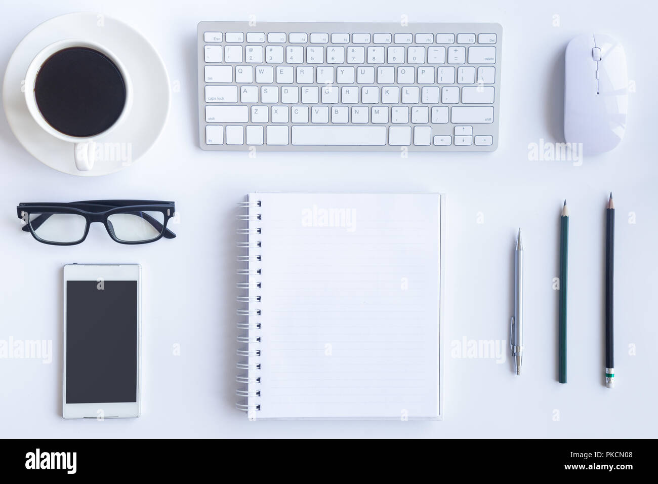 White desk office with laptop, smartphone and other work supplies with ...