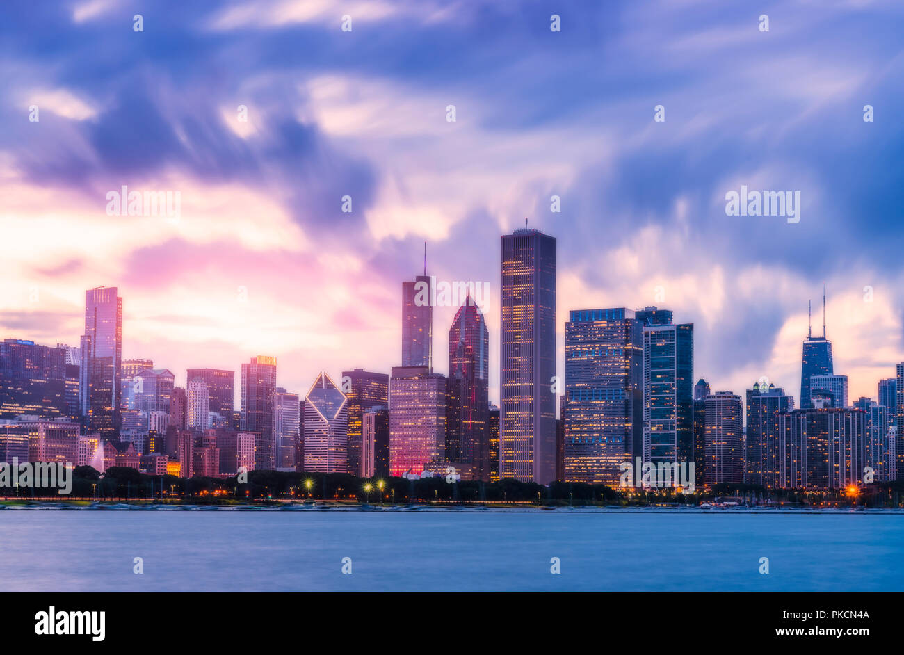 Chicago skyline at sunset with cloudy sky and reflection in water Stock ...