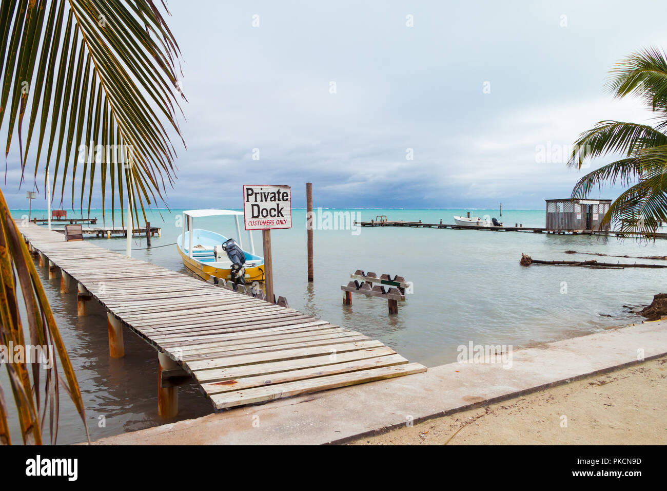Small Boat, Mooring Posts and Private Dock Sign Stock Photo - Alamy