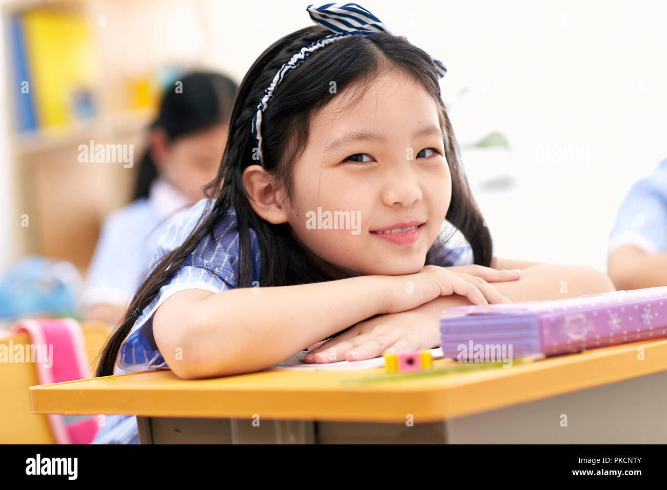 Primary school girls in the classroom Stock Photo - Alamy