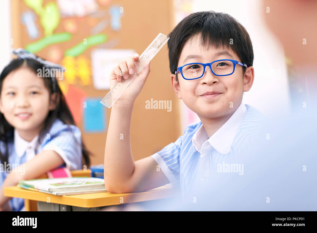 Elementary school students in the classroom Stock Photo - Alamy