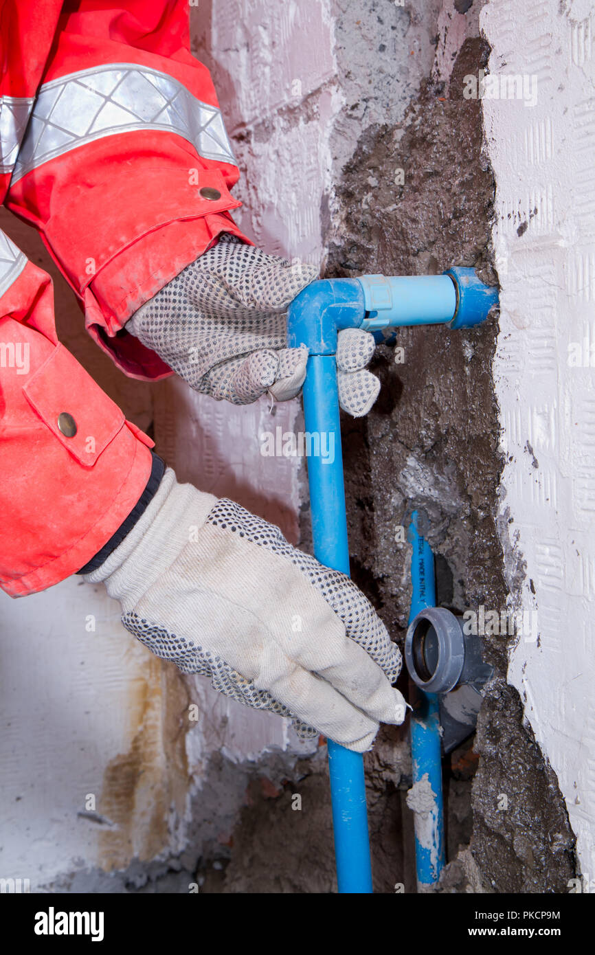 plumber at work with pipes Stock Photo - Alamy
