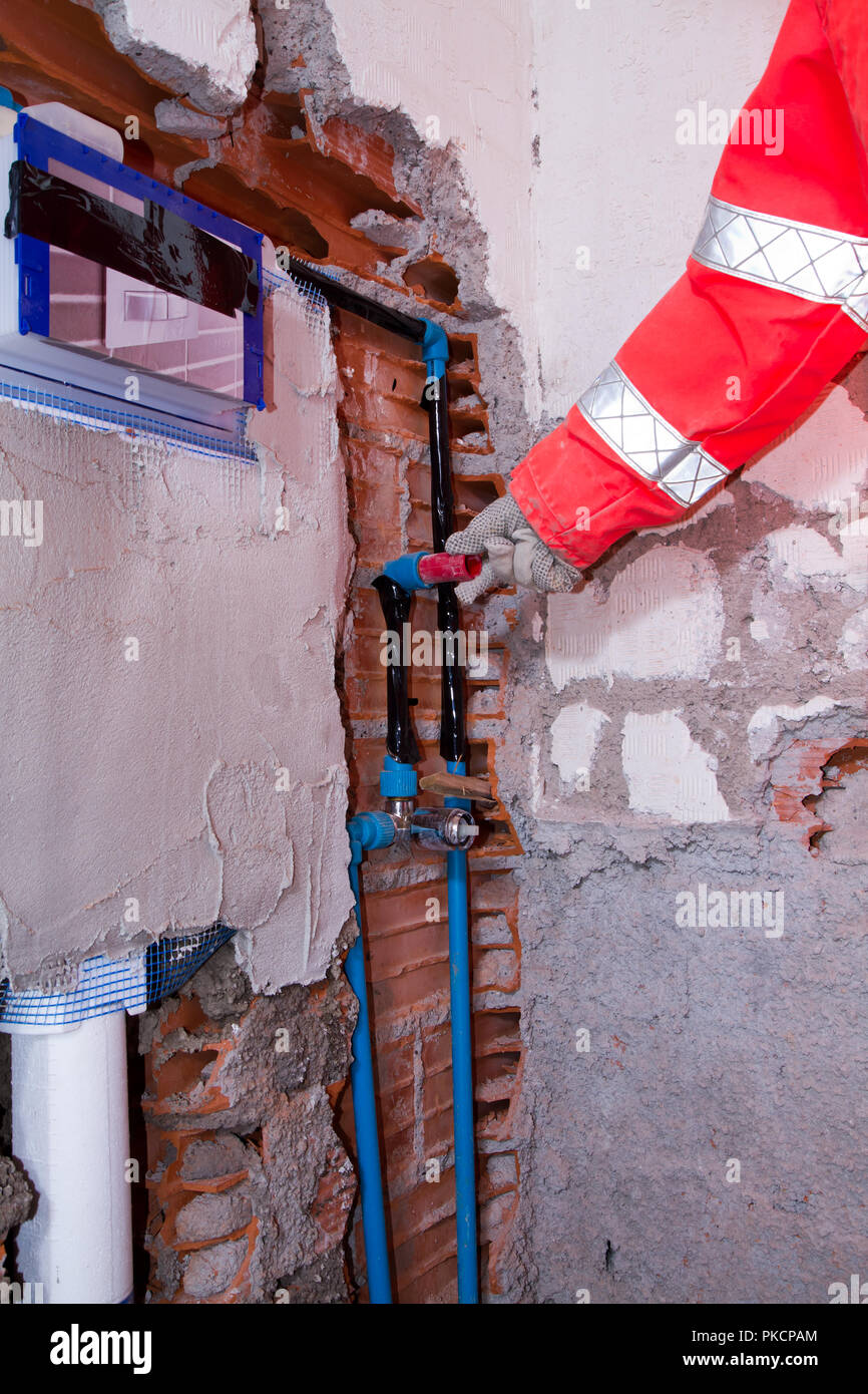 plumber at work with pipes Stock Photo - Alamy