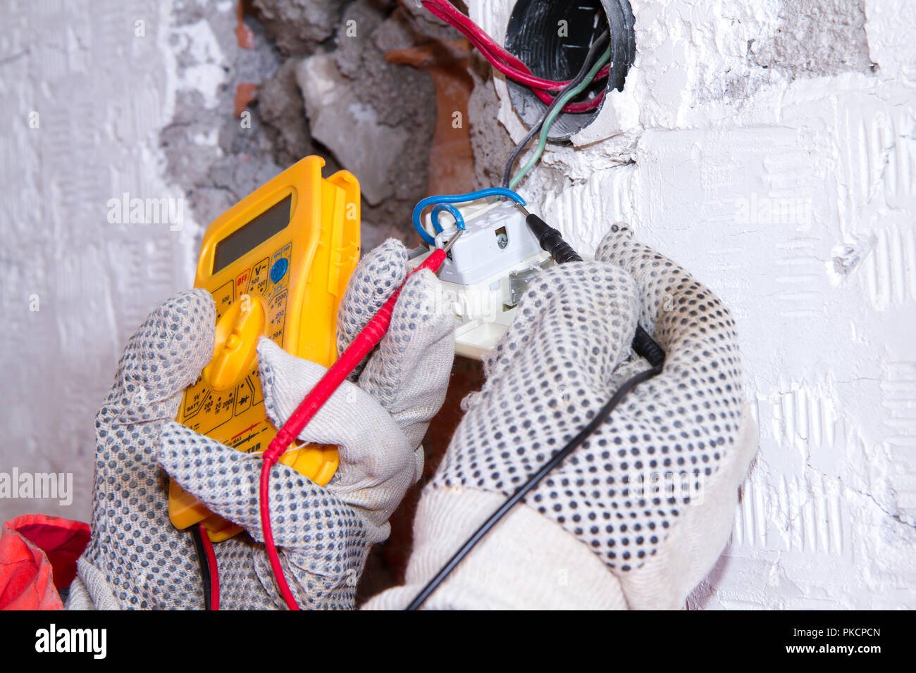 electrician at work with a plug Stock Photo - Alamy
