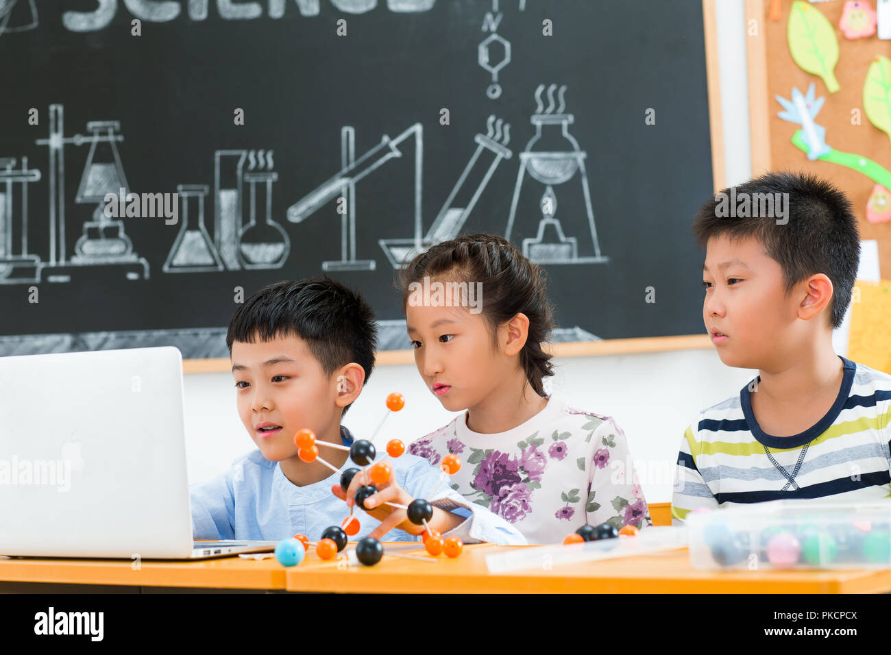 Elementary school students use computers in the classroom Stock Photo ...