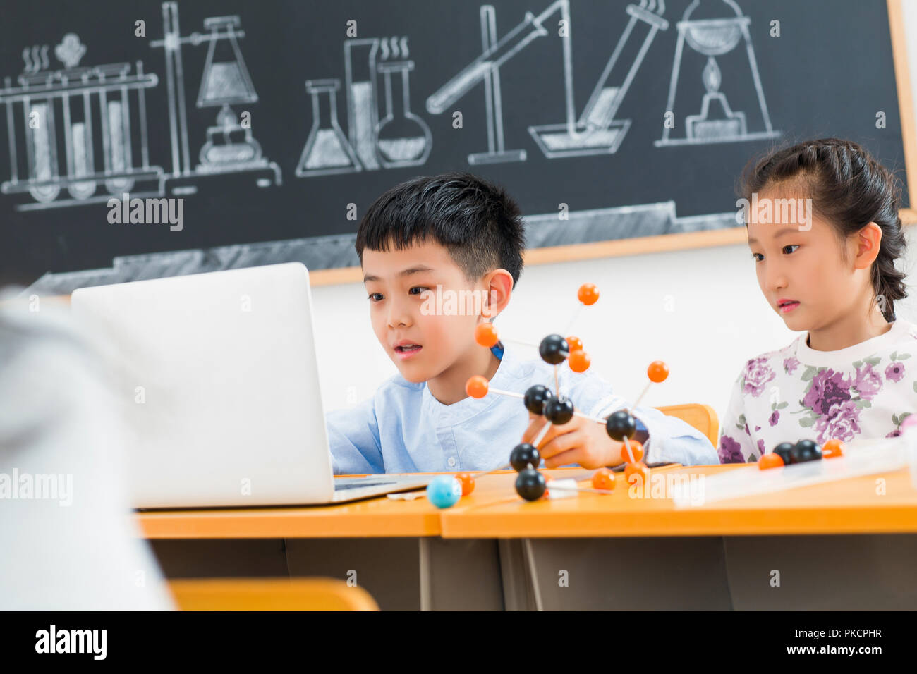Elementary school students use computers in the classroom Stock Photo ...