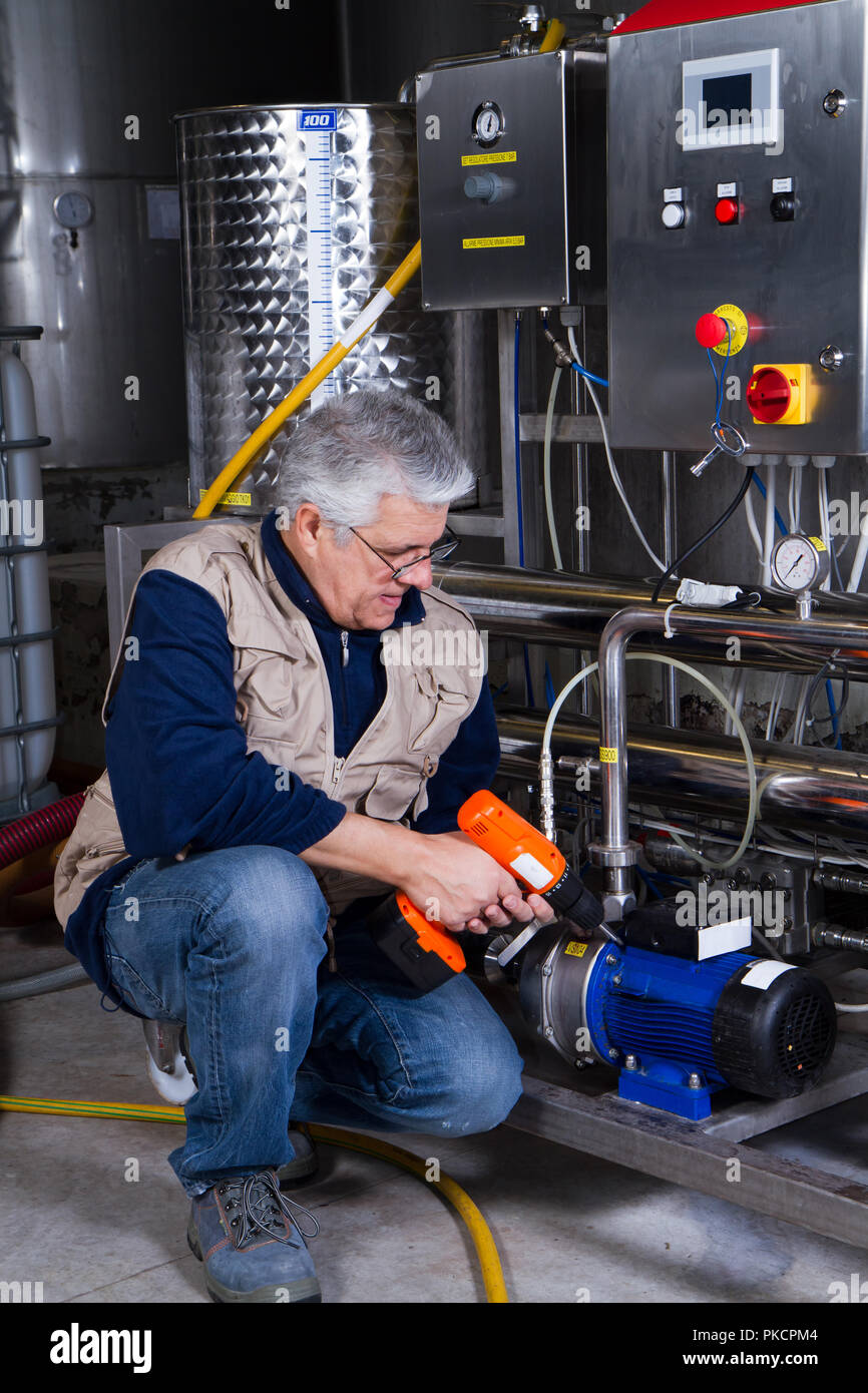 repairman at maintenance work Stock Photo - Alamy