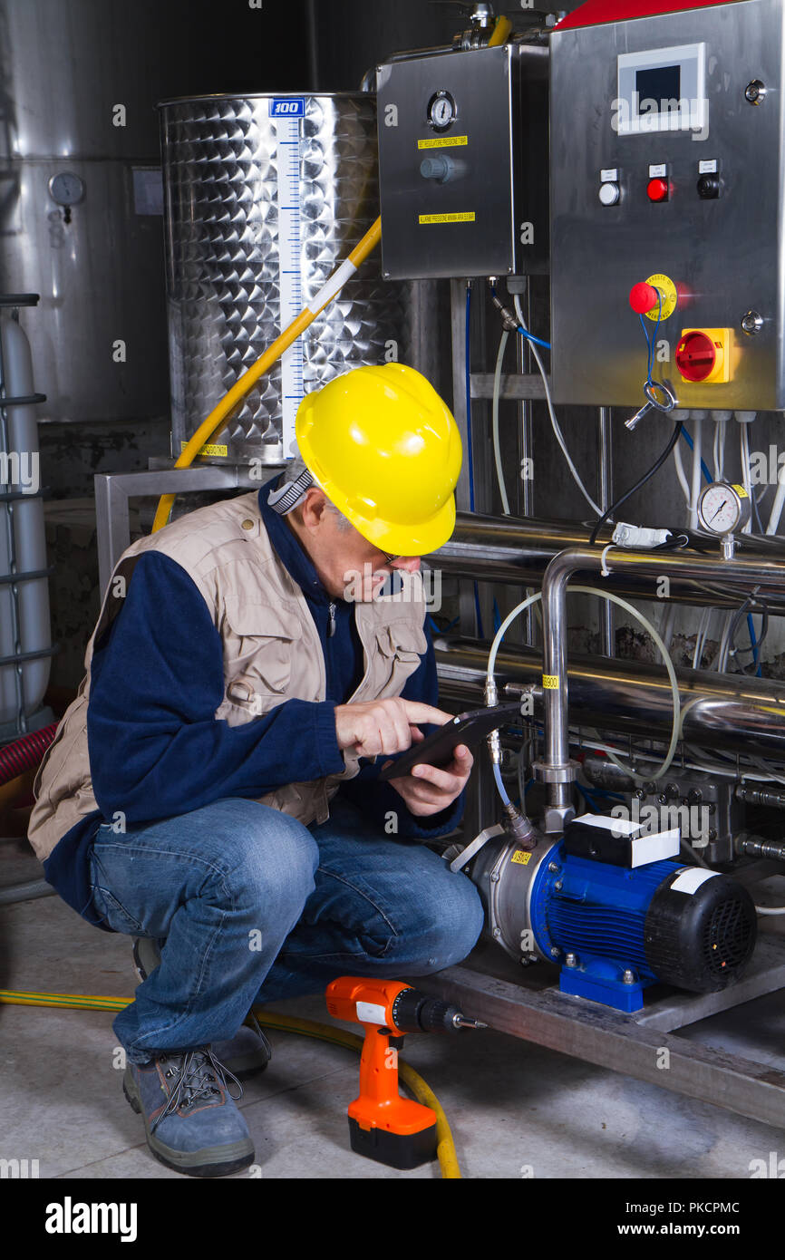 repairman at maintenance work Stock Photo - Alamy