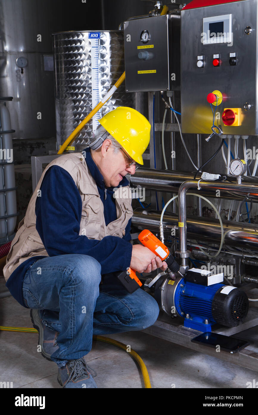 repairman at maintenance work Stock Photo - Alamy