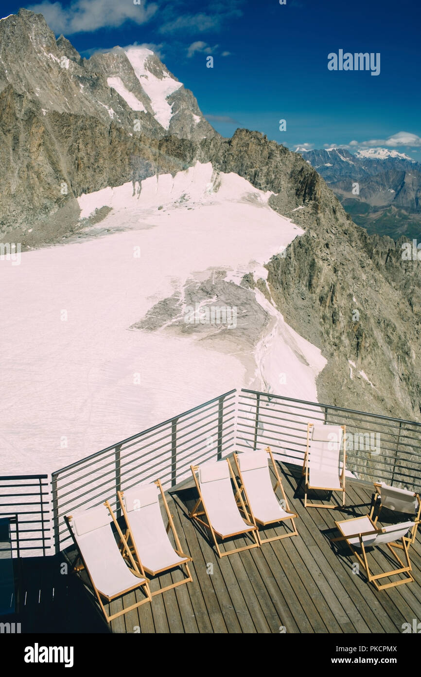 Empty Chaise Lounges on the terrace Punta Helbronner, top view ...