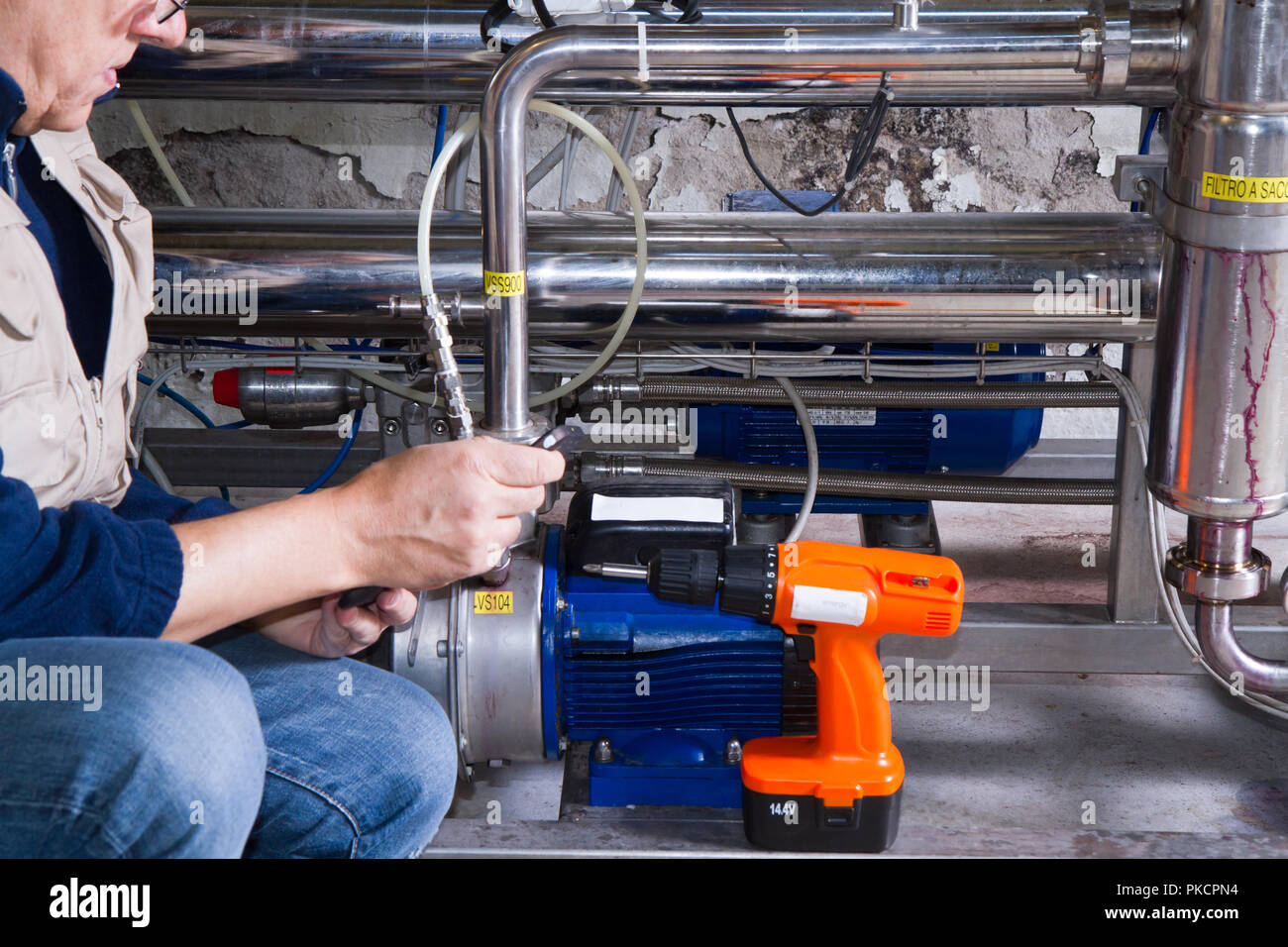repairman at maintenance work Stock Photo - Alamy