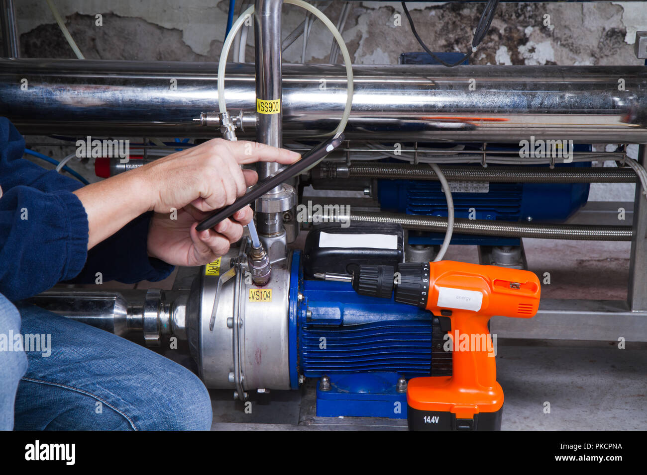 repairman at maintenance work Stock Photo - Alamy