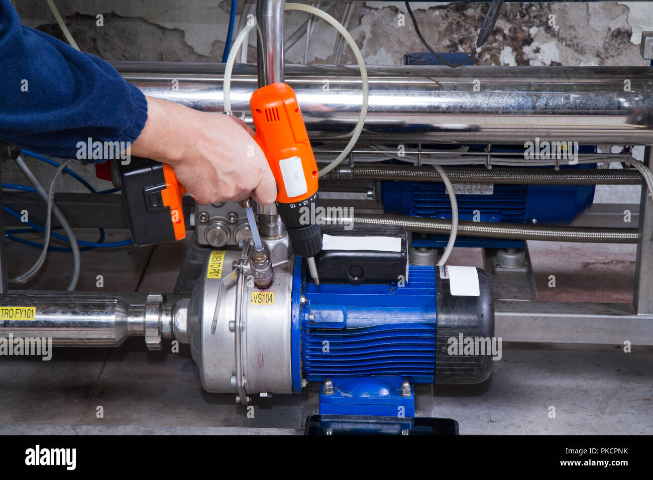 repairman at maintenance work Stock Photo - Alamy