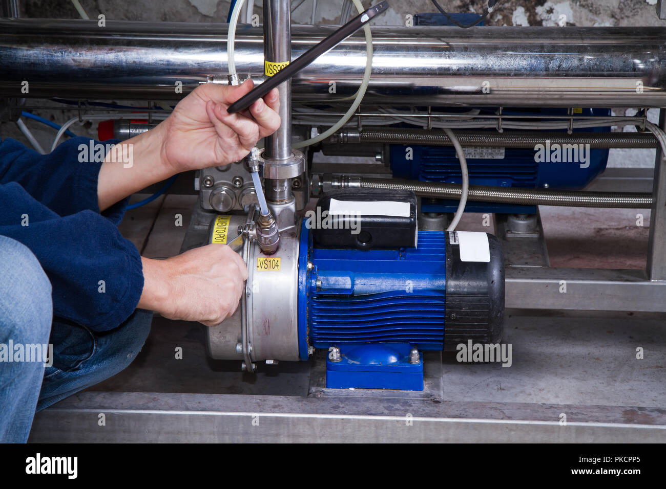 repairman at maintenance work Stock Photo - Alamy