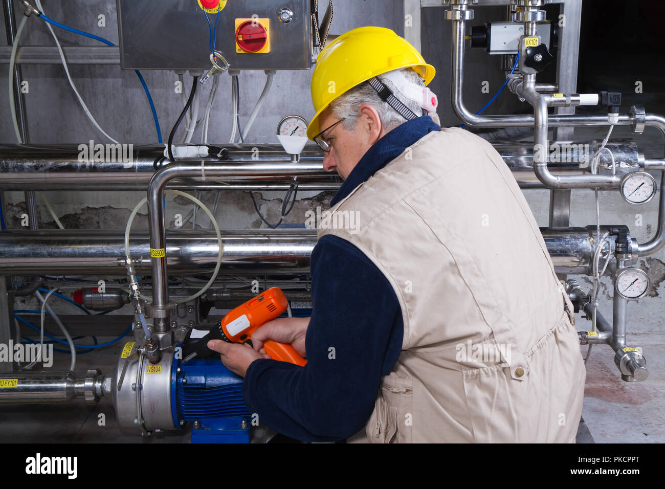repairman at maintenance work Stock Photo - Alamy