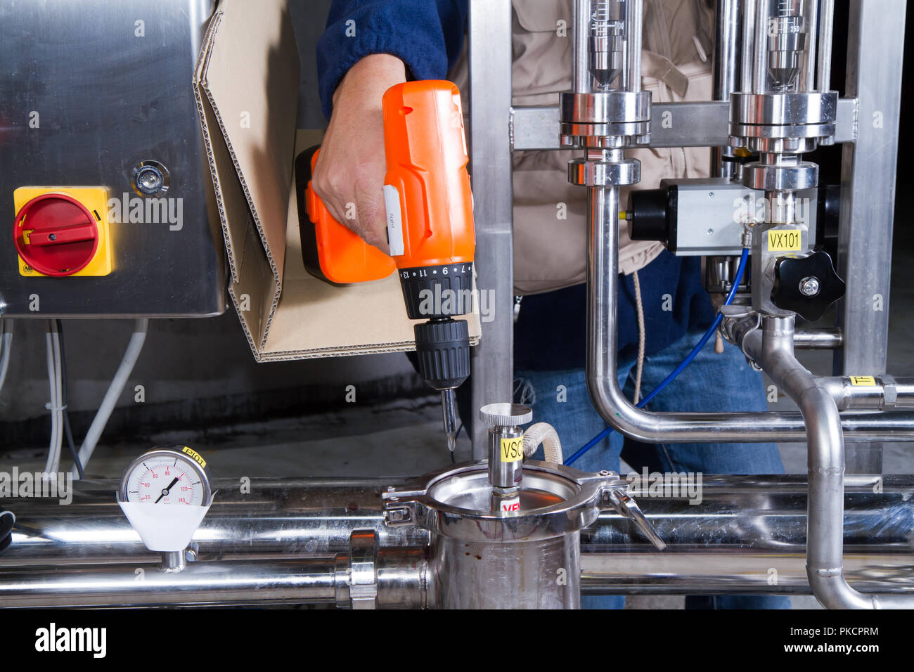 repairman at maintenance work Stock Photo - Alamy