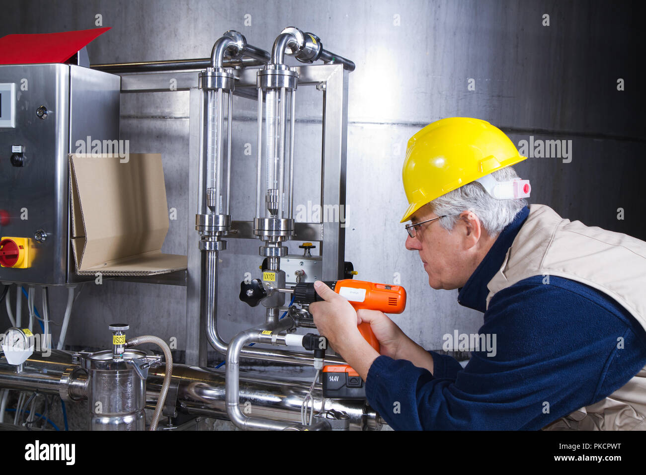 repairman at maintenance work Stock Photo - Alamy