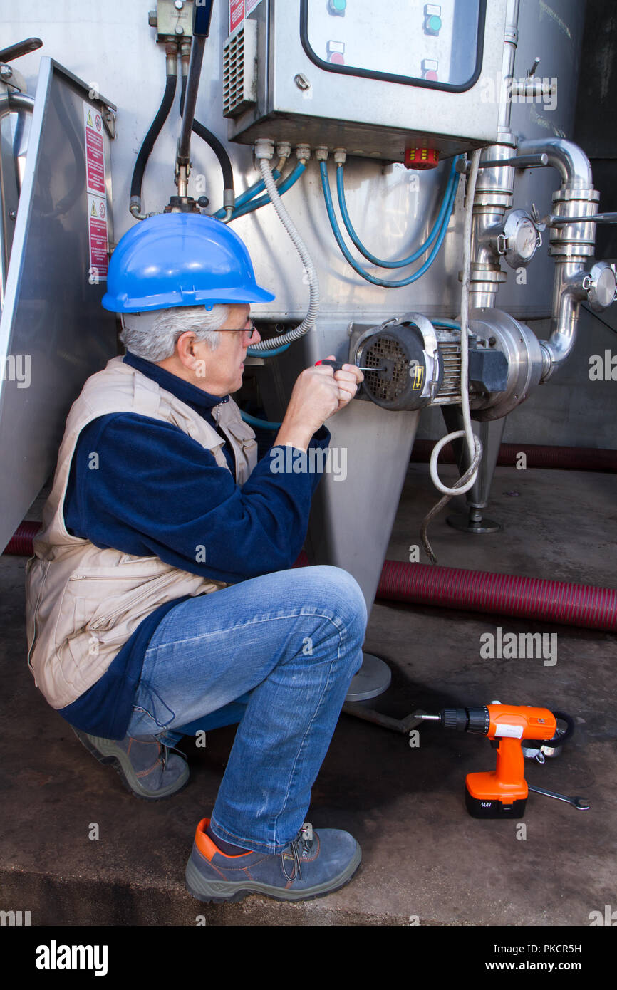 repairman during maintenance work Stock Photo - Alamy