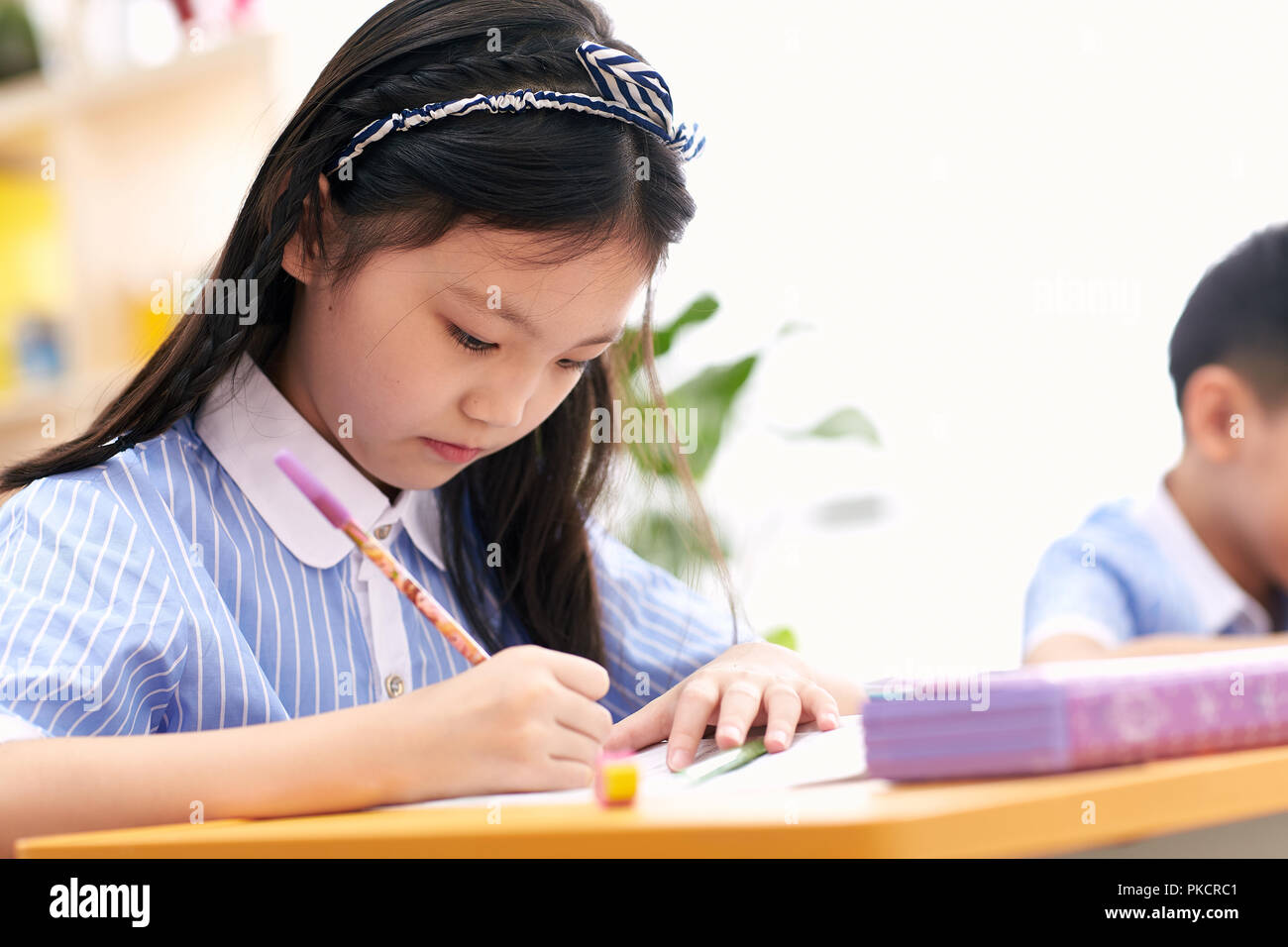 Primary school girls in the classroom Stock Photo - Alamy