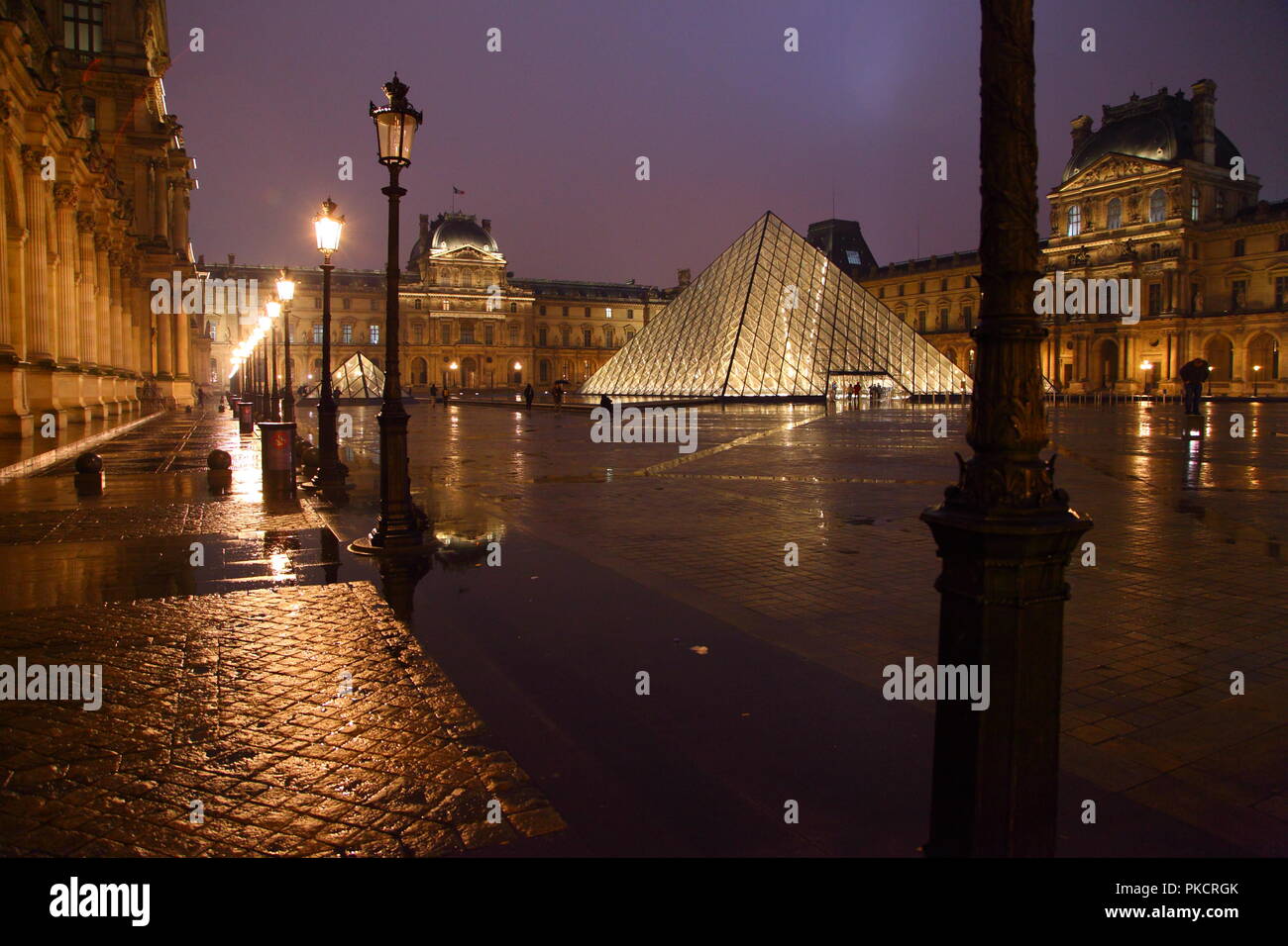 Louvre in Paris at night Stock Photo - Alamy