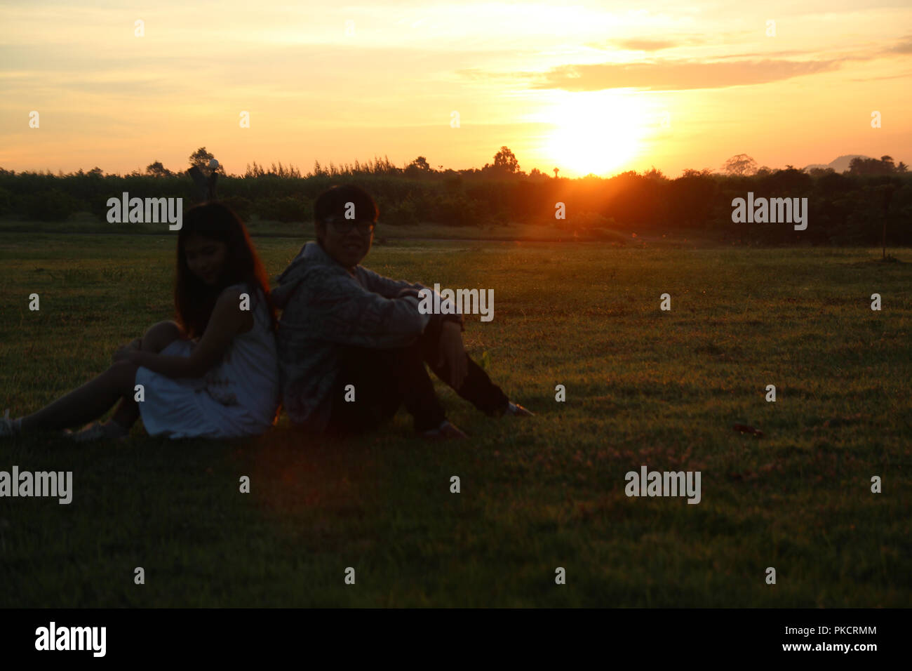 Shadow image of couples ,The couple sit back-to-back watch light the ...