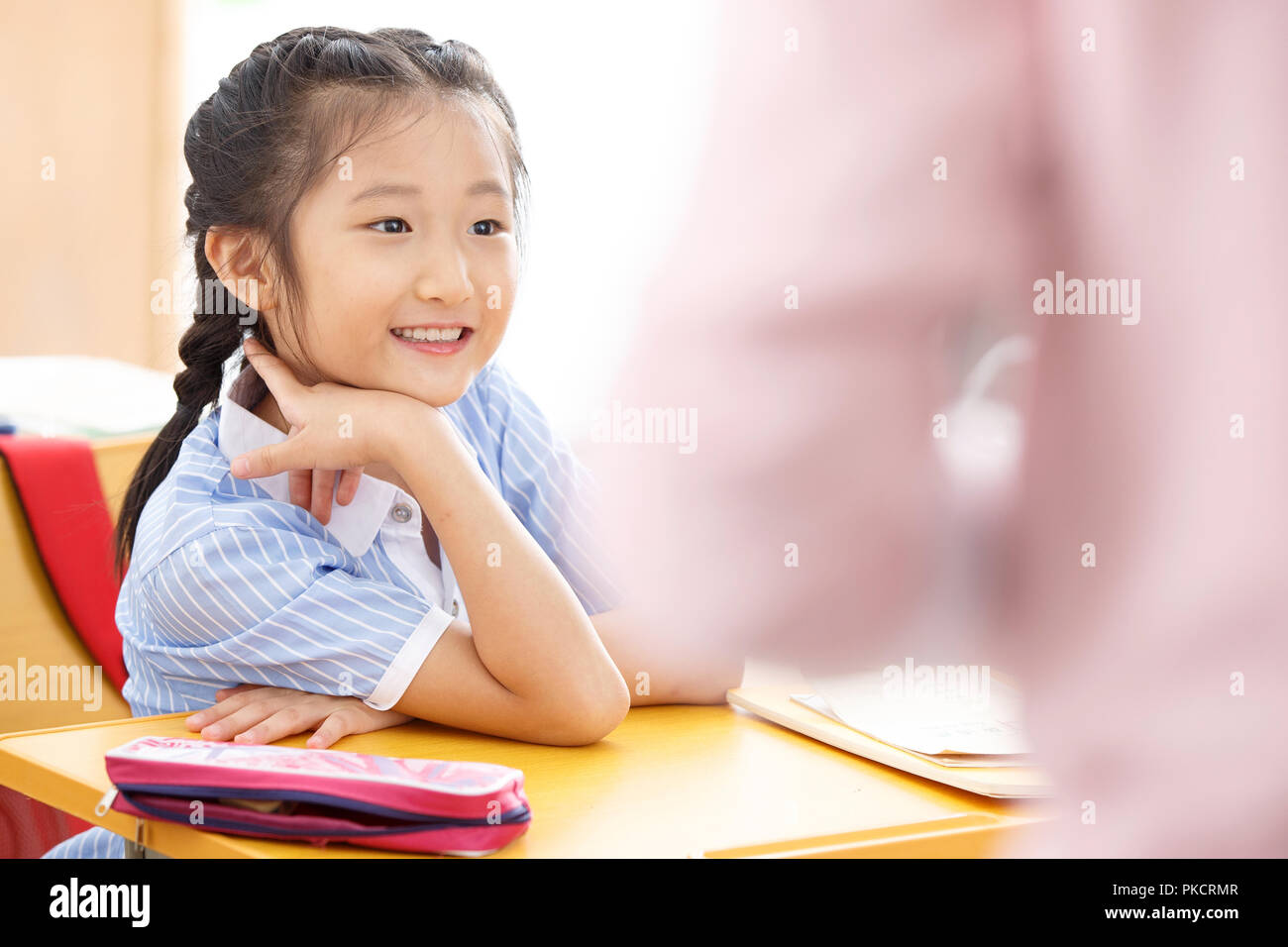 Primary school girls in the classroom Stock Photo - Alamy