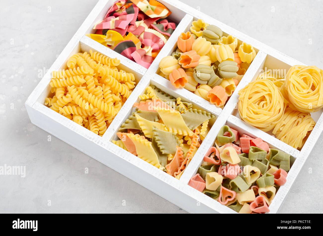Variety of types and shapes of raw Italian pasta Stock Photo - Alamy