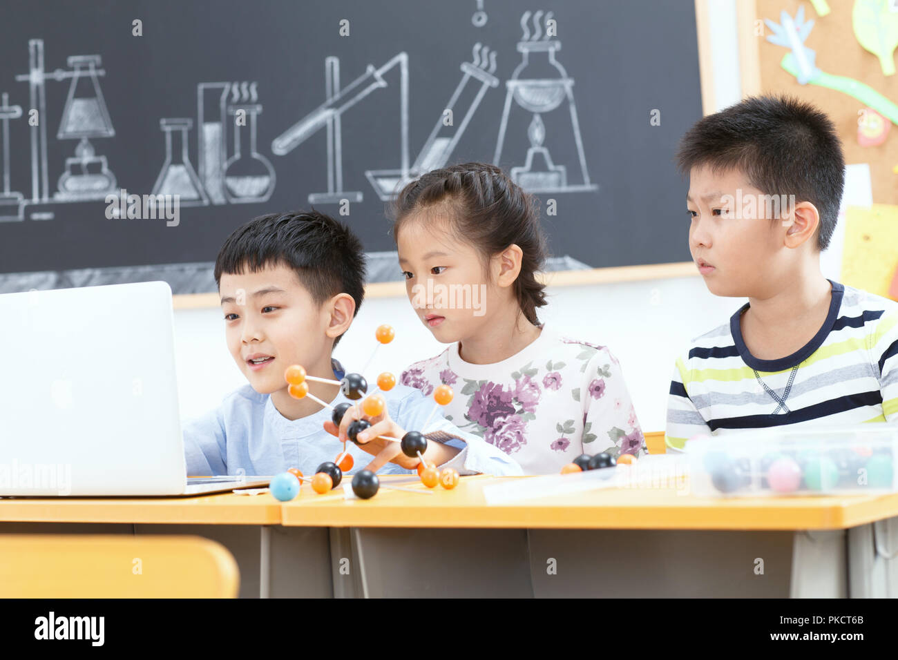 Elementary school students use computers in the classroom Stock Photo ...
