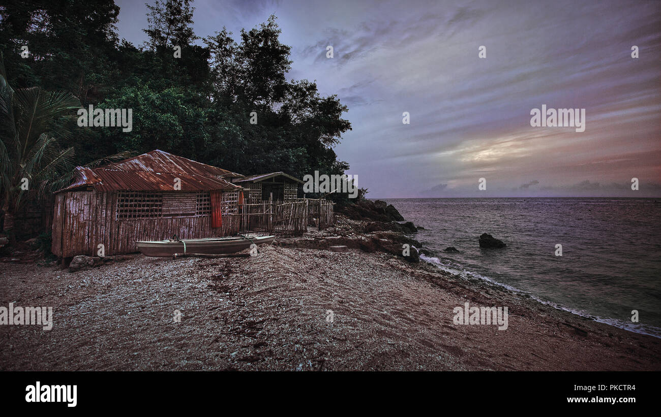 simple life in fishing hut and small fisher boat in the Philippines ...