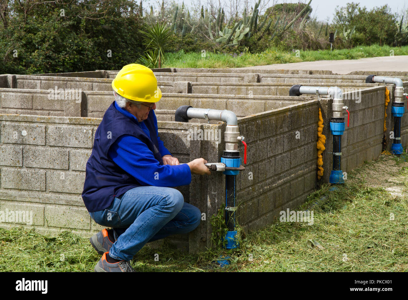 plumber at work in wastewater treatment plant Stock Photo - Alamy