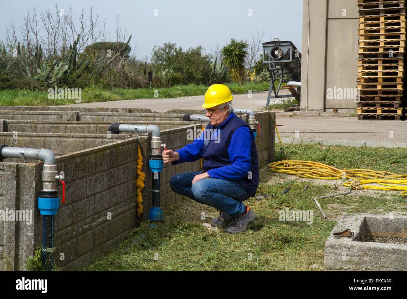 plumber at work in wastewater treatment plant Stock Photo - Alamy